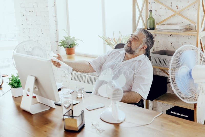 Businessman, Manager in Office with Computer and Fan Cooling Off ...