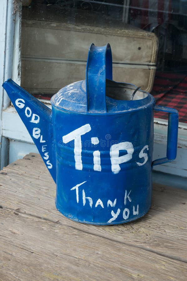 Watering Can Serves As a Tip Jar Stock Image - Image of city, loving ...