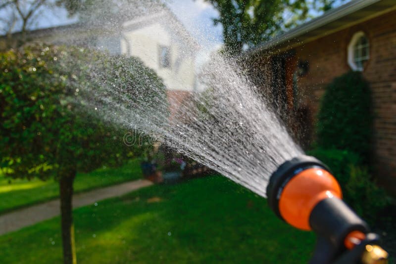 Watering the Front Lawn in Spring Time Stock Image - Image of america ...