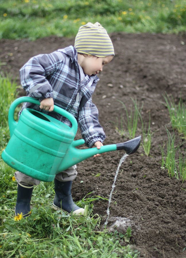 Watering soil stock image. Image of outdoor, sowing, young - 15734795