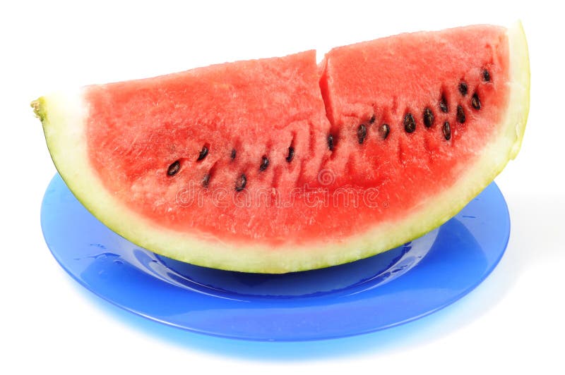 Watermelon on blue plate stock photo. Image of green - 15358270