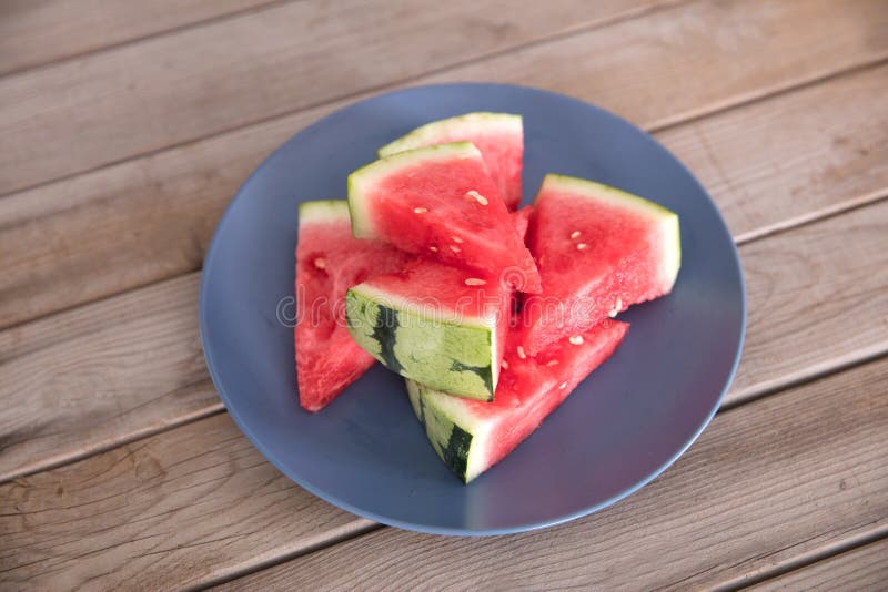 Watermelon Cut into Small Pieces on a Plate Stock Image - Image of ...