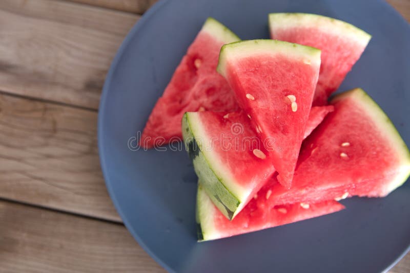 Watermelon Cut into Small Pieces on a Plate Stock Photo - Image of ...
