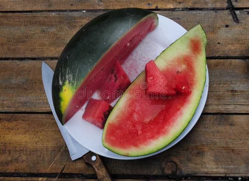 Watermelon on garden table stock image. Image of tasty - 42053463