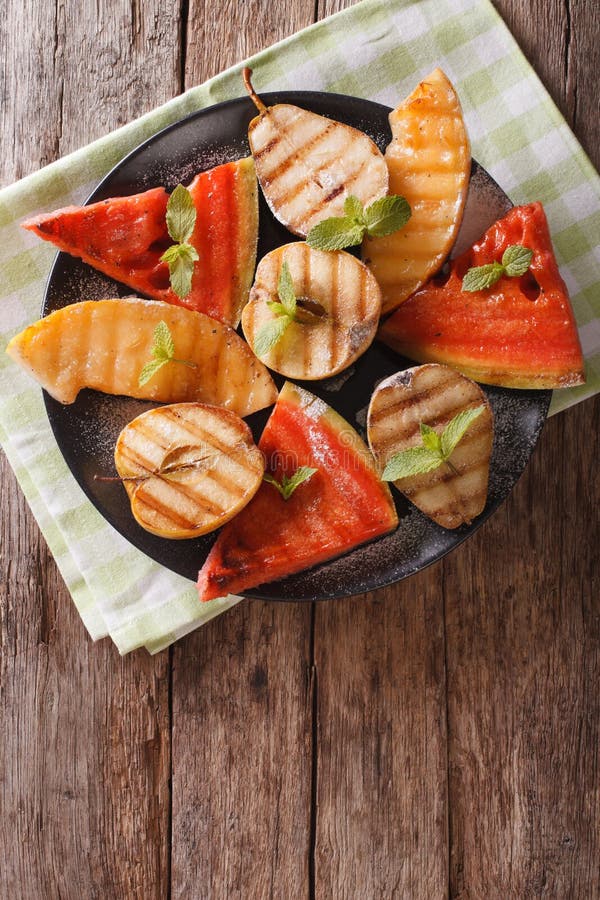 Watermelon, Pear, Apple and Melon Grilled Close-up. Vertical Top Stock ...
