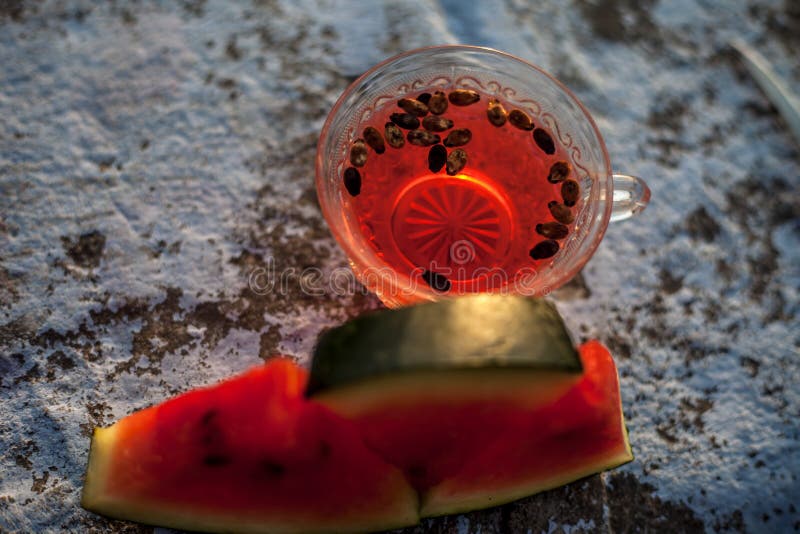 Watermelon Seeds Tea in a Transparent Glass Cup on Rough Surface with ...