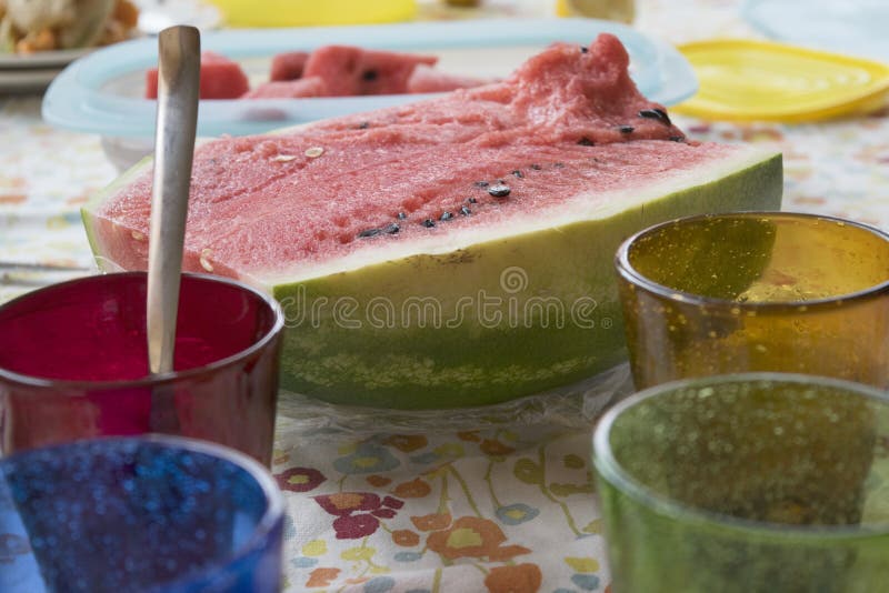 Watermelon on a set table stock photo. Image of table - 83922576