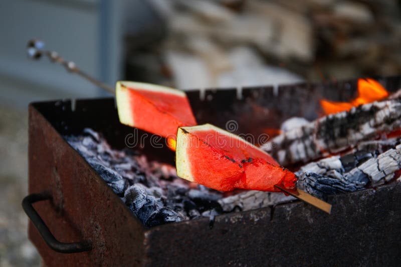 Watermelon on a Skewer is Fried on a Fire Stock Photo - Image of ...