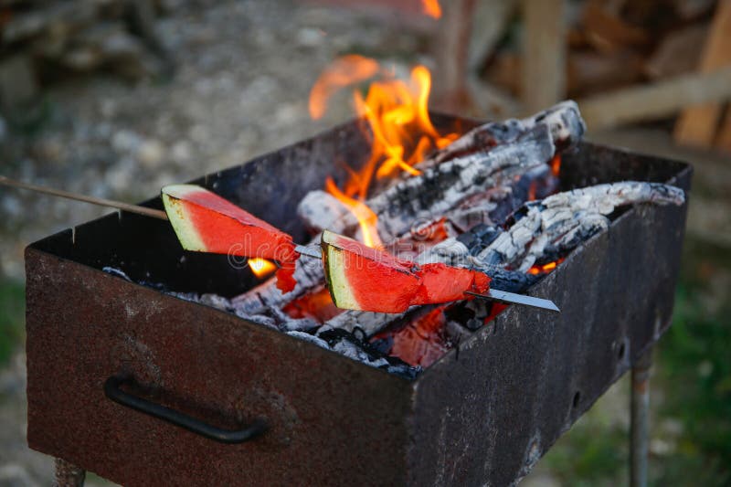 Watermelon on a Skewer is Fried on a Fire Stock Photo - Image of juicy ...
