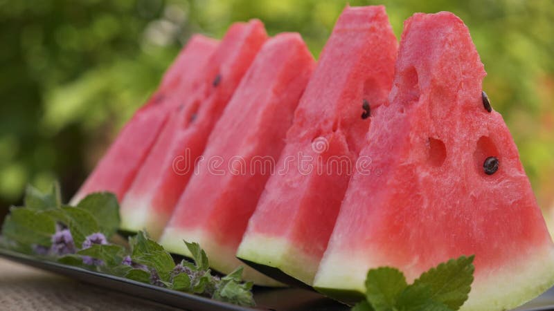 Watermelon Slices Fall on a Wet Table. Filmed on a High-speed Camera at ...