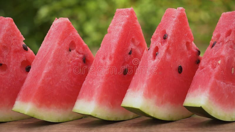 Watermelon Slices in a Row on the Table - Close Up Stock Video - Video ...