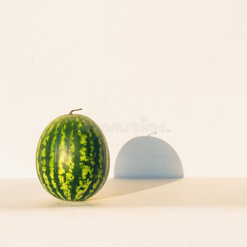 Watermelon on the Stone Bench on the White Wall Background. Stock Photo ...