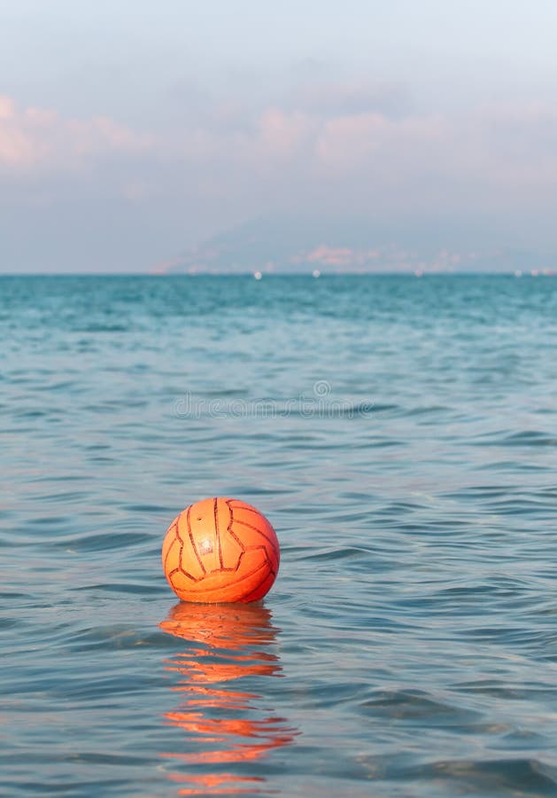 Waterpolo Ball Floating in the Sea Waters Stock Photo - Image of ...