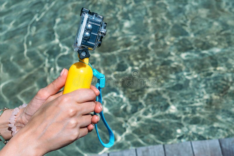 Waterproof Action Camera with a Yellow Float in a Man`s Hand ...