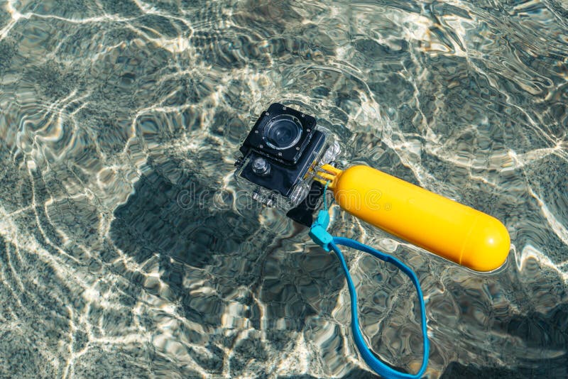 Waterproof Action Camera with a Yellow Float in a Man`s Hand ...