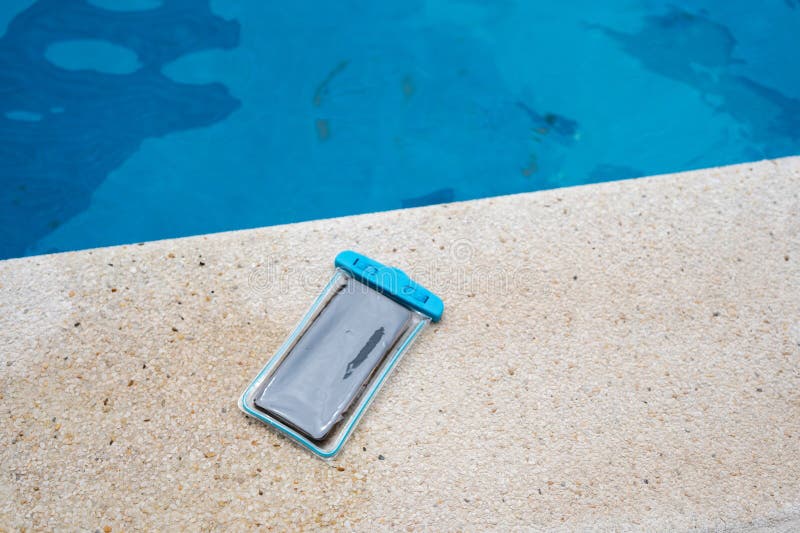 Waterproof Case with a Smartphone on the Background of the Pool on a ...
