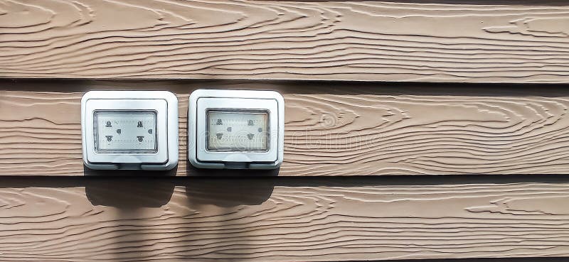 Waterproof Electrical Sockets Installed Outdoors on Dark Wooden Walls ...