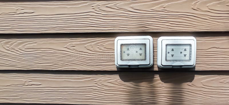 Waterproof Electrical Sockets Installed Outdoors on Dark Wooden Walls ...