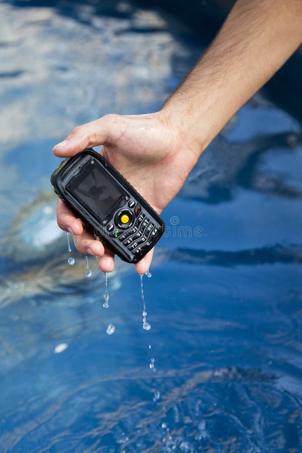 Testing a Rugged Mobile Phone Stock Photo - Image of spray, holiday ...