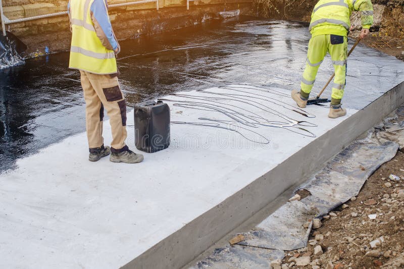 Waterproofing Coating. Builder Applying Waterproofing Bitumen Mastic on ...
