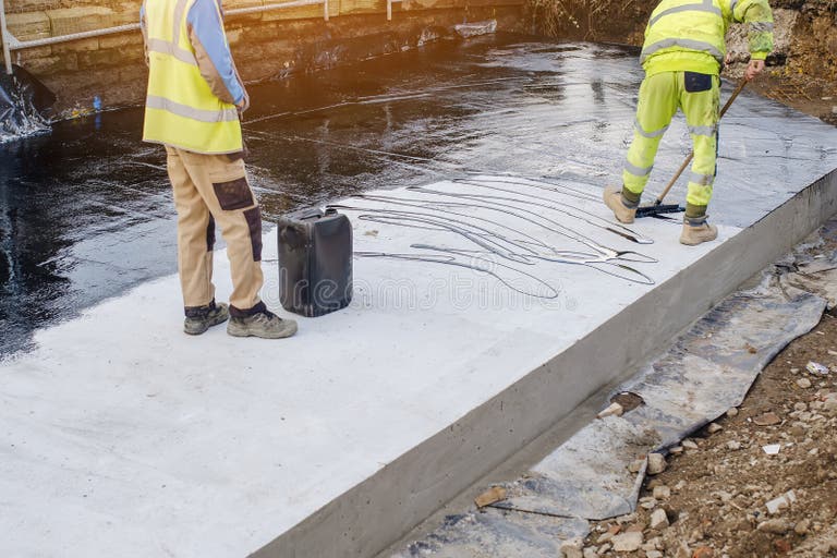 Waterproofing Coating. Builder Applying Waterproofing Bitumen Mastic on ...