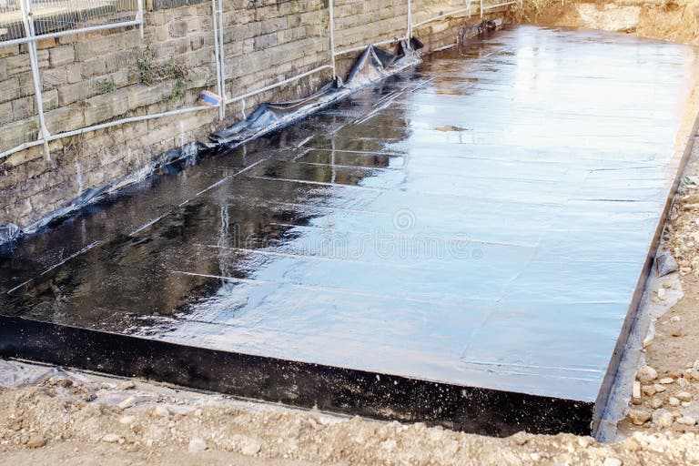 Waterproofing Coating. Builder Applying Waterproofing Bitumen Mastic on ...