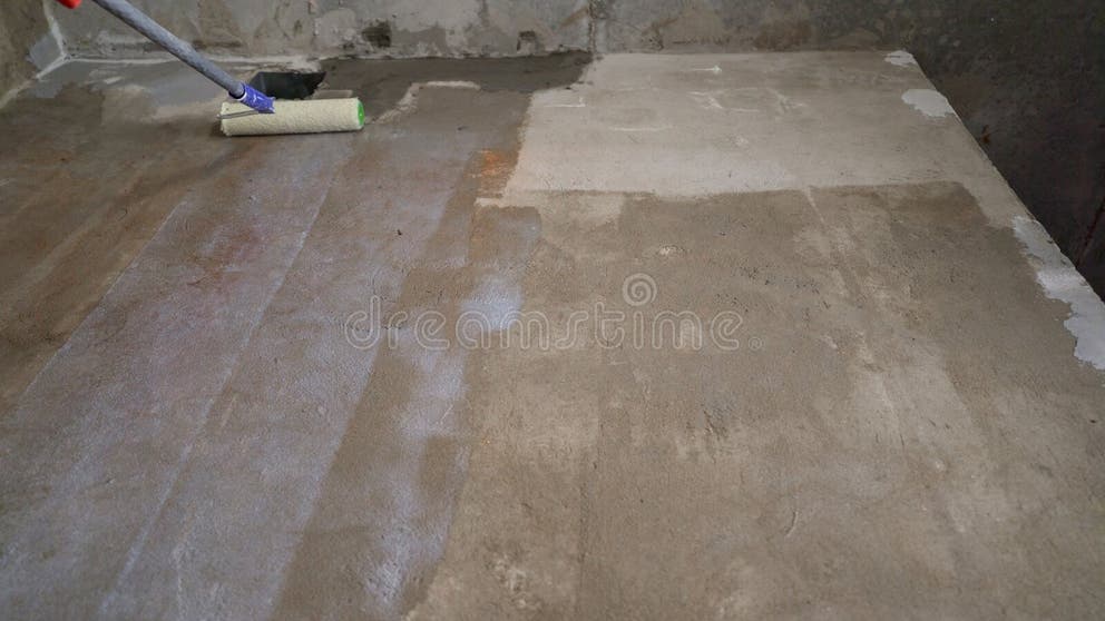 Construction Worker Applying Waterproofing Coating on Concrete Floor ...