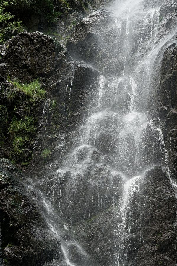 The Waters of a High, Powerful Waterfall Tumbling Down a Violent Stream ...