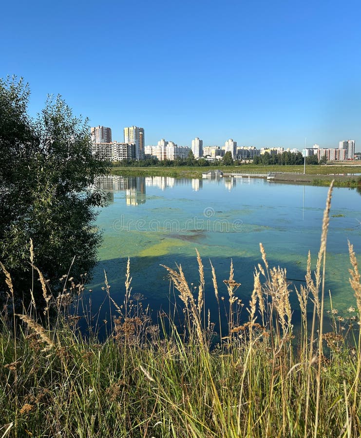 Waterscape with Beautiful Blue Sky and City in the Distance Stock Image ...