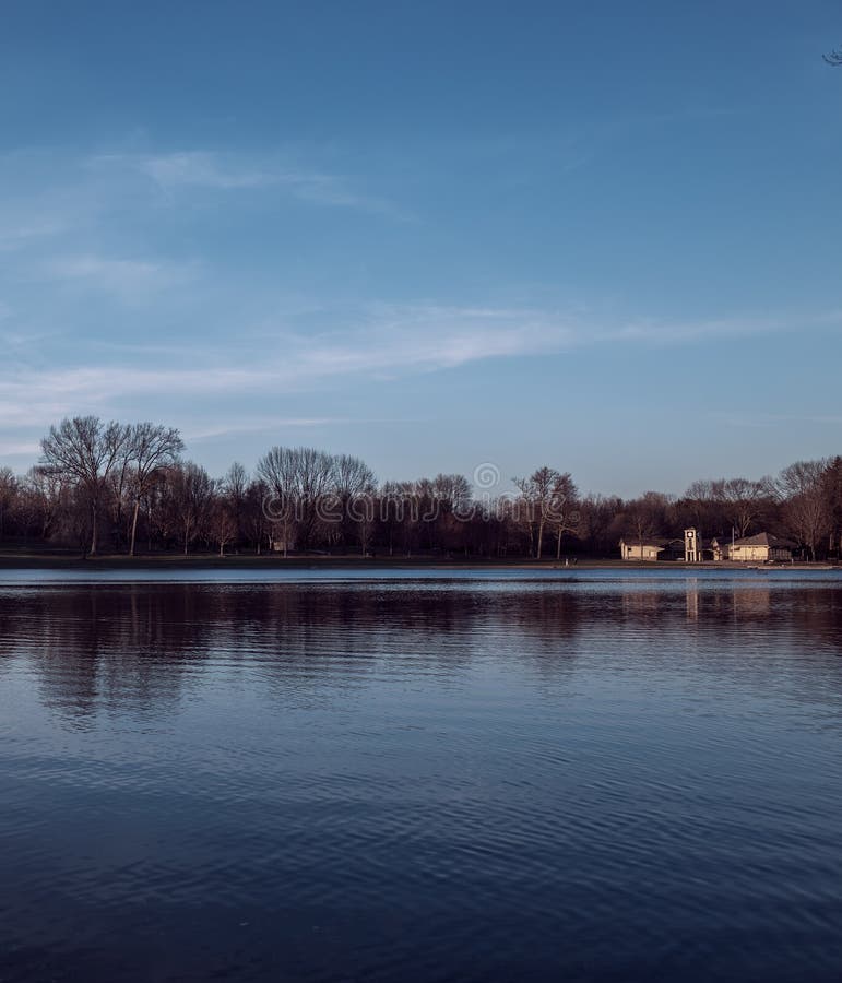 Waterway beside Trees and Buildings in a Scenic Setting Stock Photo ...