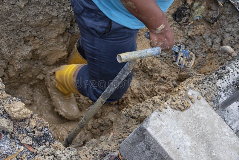 Waterworks Worker Repairing the Water Ferrule Valve Pipe from Leakage ...