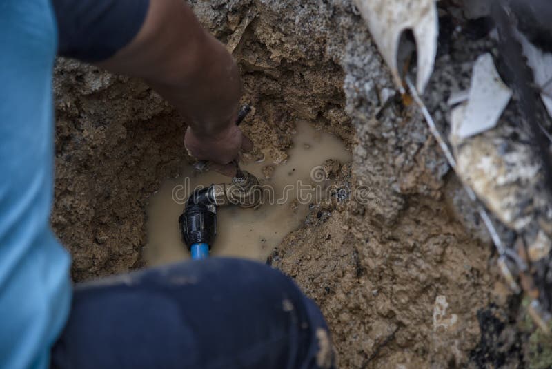 Waterworks Worker Repairing the Water Ferrule Valve Pipe from Leakage ...