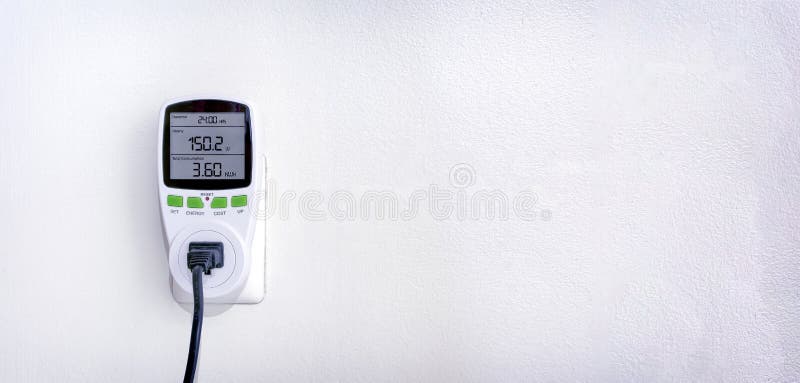 Watt Meter Plug in Operation on an Electrical Socket on the Wall Stock ...