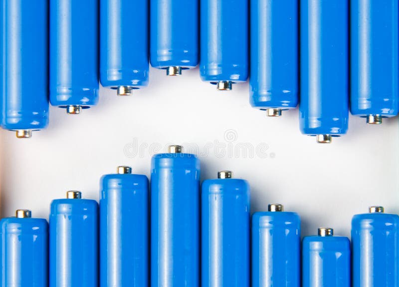Blue batteries background stock image. Image of power - 14633531