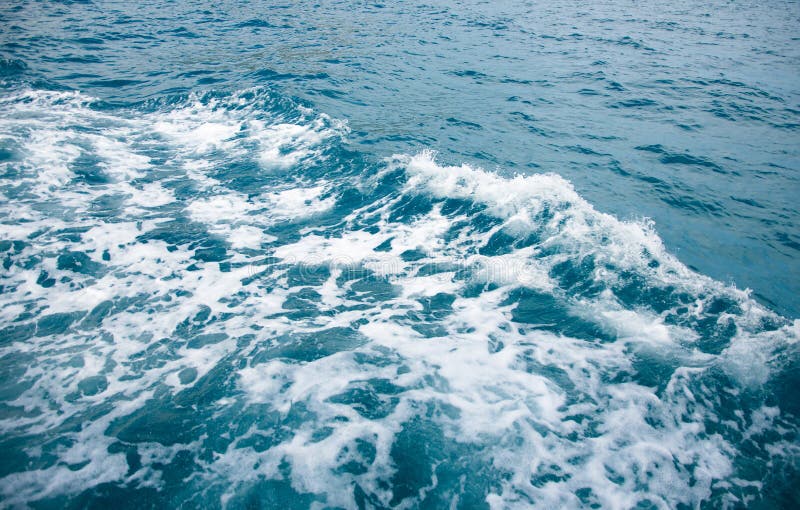 Wave on Blue Water and White Foam on the Tops of the Waves from Under ...