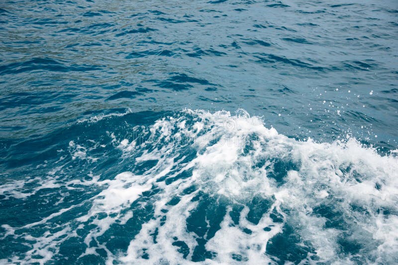 Wave on Blue Water and White Foam on the Tops of the Waves from Under ...