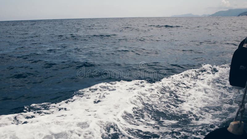 Wave on Blue Water and White Foam on the Tops of the Waves from Under ...