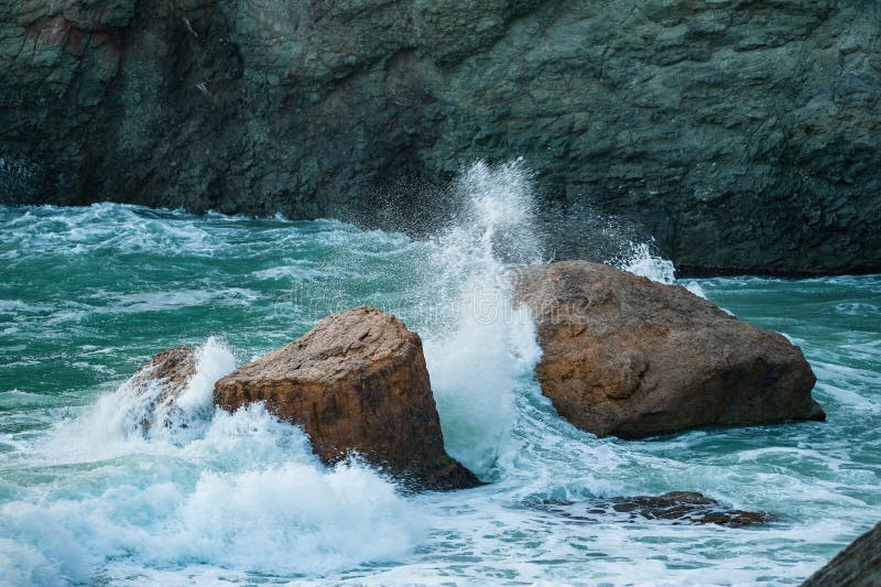 A Wave Breaking Across a Rocky Shore Stock Image - Image of ocean ...