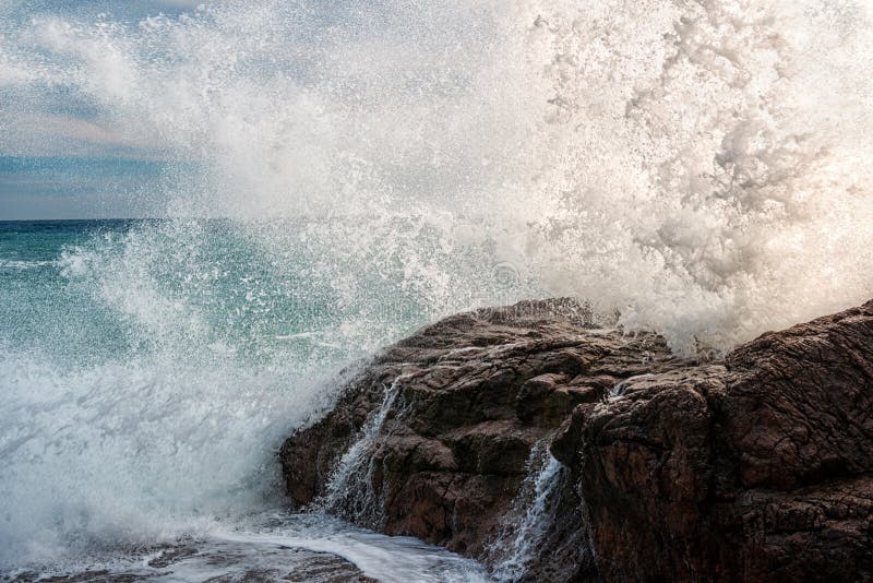 A Wave Breaking on a Coastal Rock Stock Image - Image of splashing ...