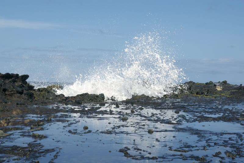Wave Breaking on Lava Rocks Stock Image - Image of relax, breaks: 68656479