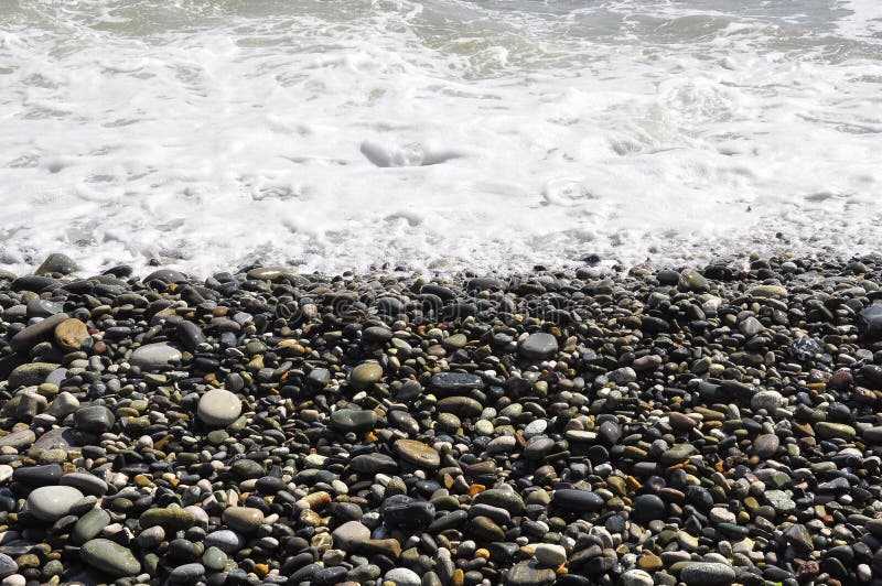 A Wave Breaking on a Pebble Beach, Close-up. Stock Photo - Image of ...