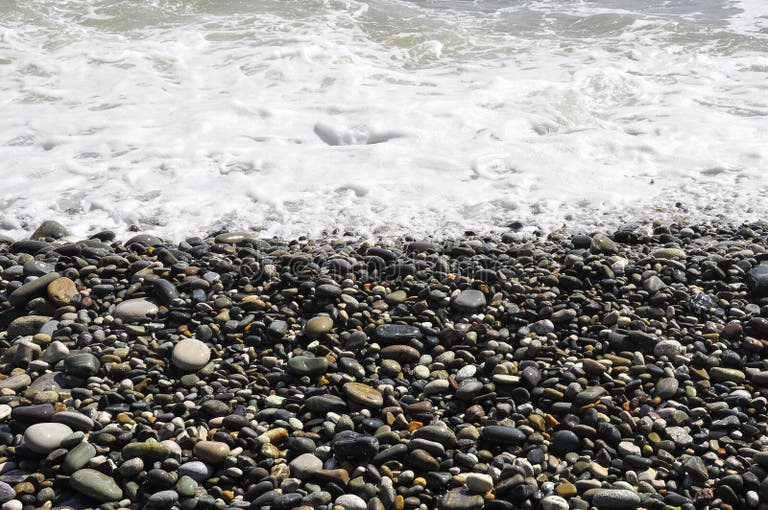 A Wave Breaking on a Pebble Beach, Close-up. Stock Photo - Image of ...