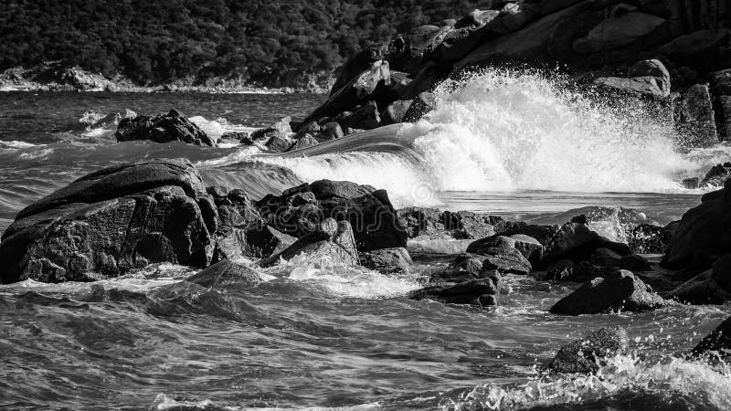 A Wave Breaking on the Rocks. Stock Photo - Image of nature, breaking ...