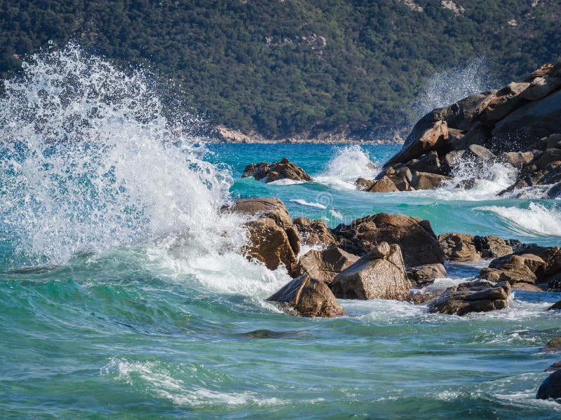 A Wave Breaking on the Rocks. Stock Photo - Image of crashing, powerful ...