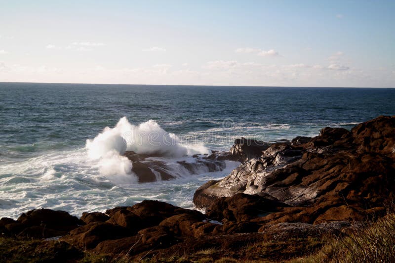 Wave breaking on the rocks stock image. Image of recreation - 51114909