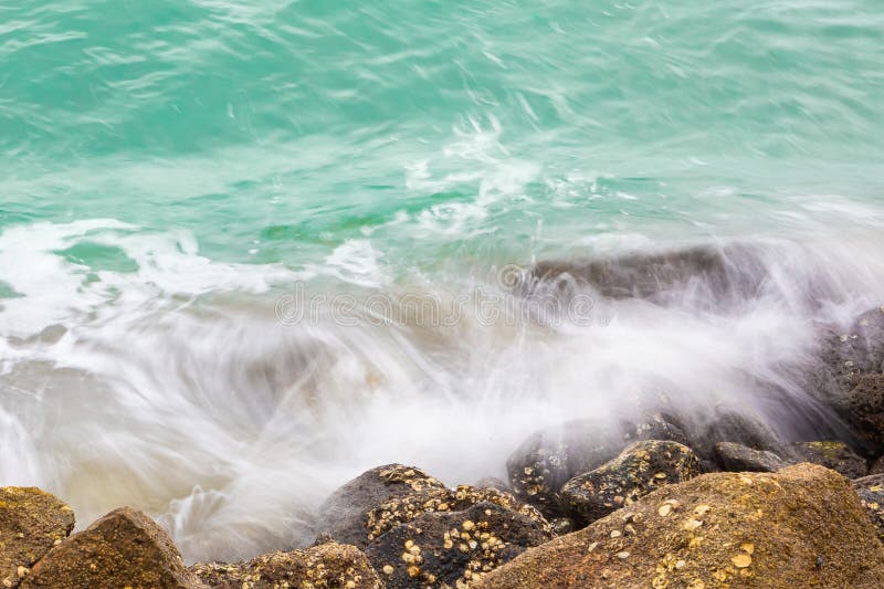 Wave Breaking on Rocks Photographed at Low Speed Stock Image - Image of ...