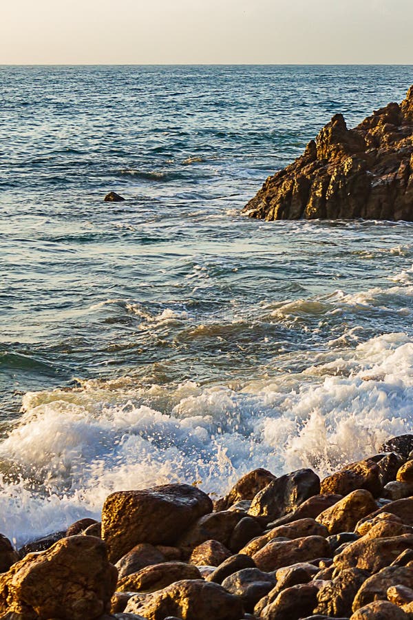 Wave Breaking on Rocks at Shoreline with Sunrise Stock Image - Image of ...