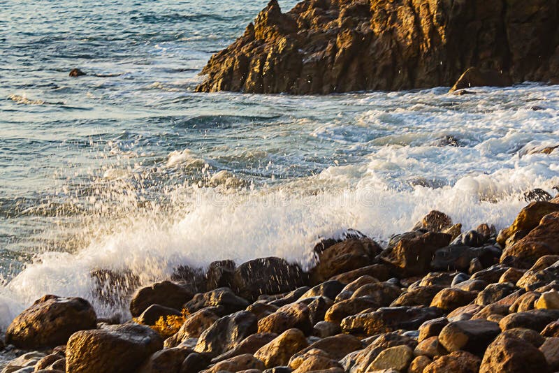 Wave Breaking on Rocks at Shoreline with Sunrise Stock Photo - Image of ...