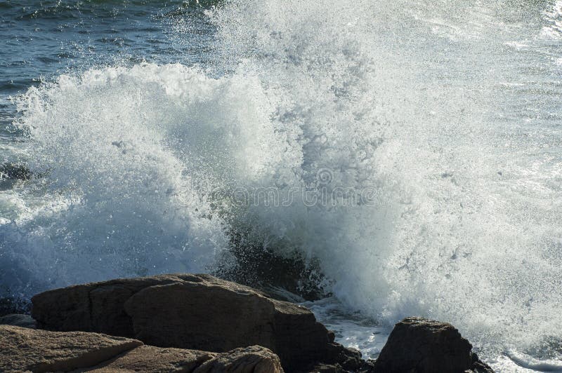 Wave breaking on rocks stock image. Image of rocks, whitewater - 63367143
