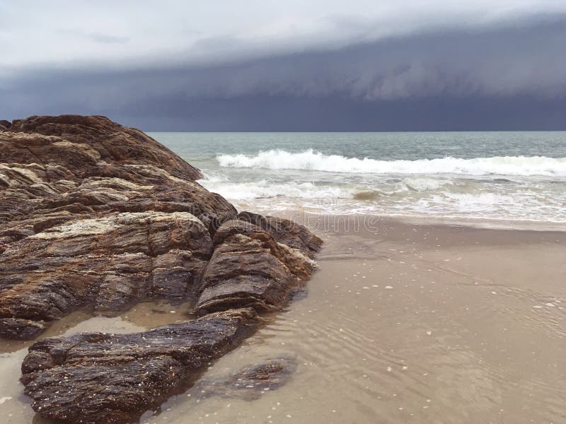 Wave breaking rocks stock image. Image of ocean, coast - 133248475